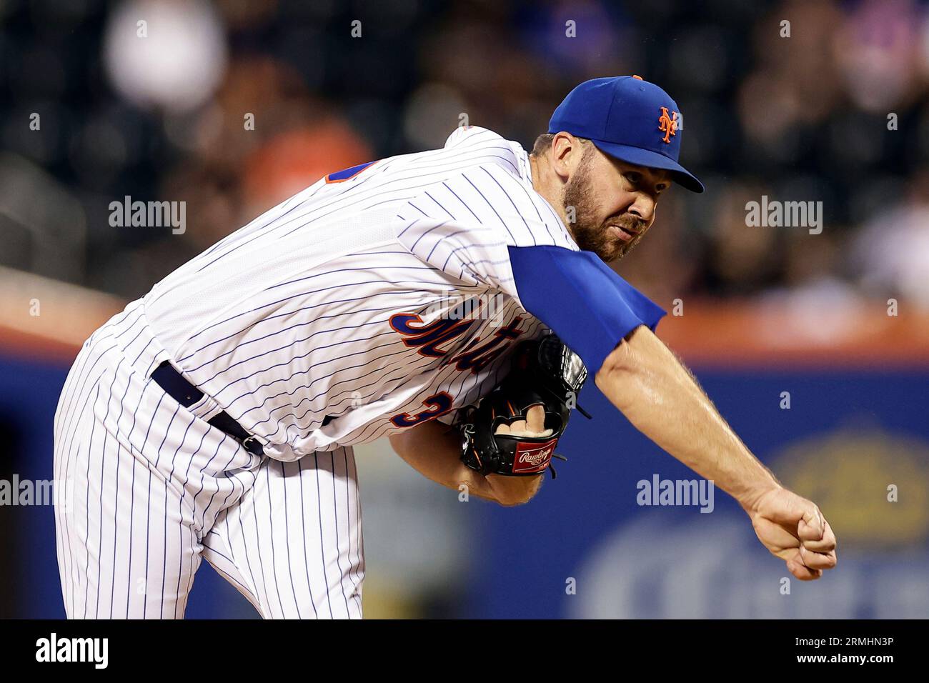 New York Mets pitcher Tylor Megill throws against the Texas Rangers ...