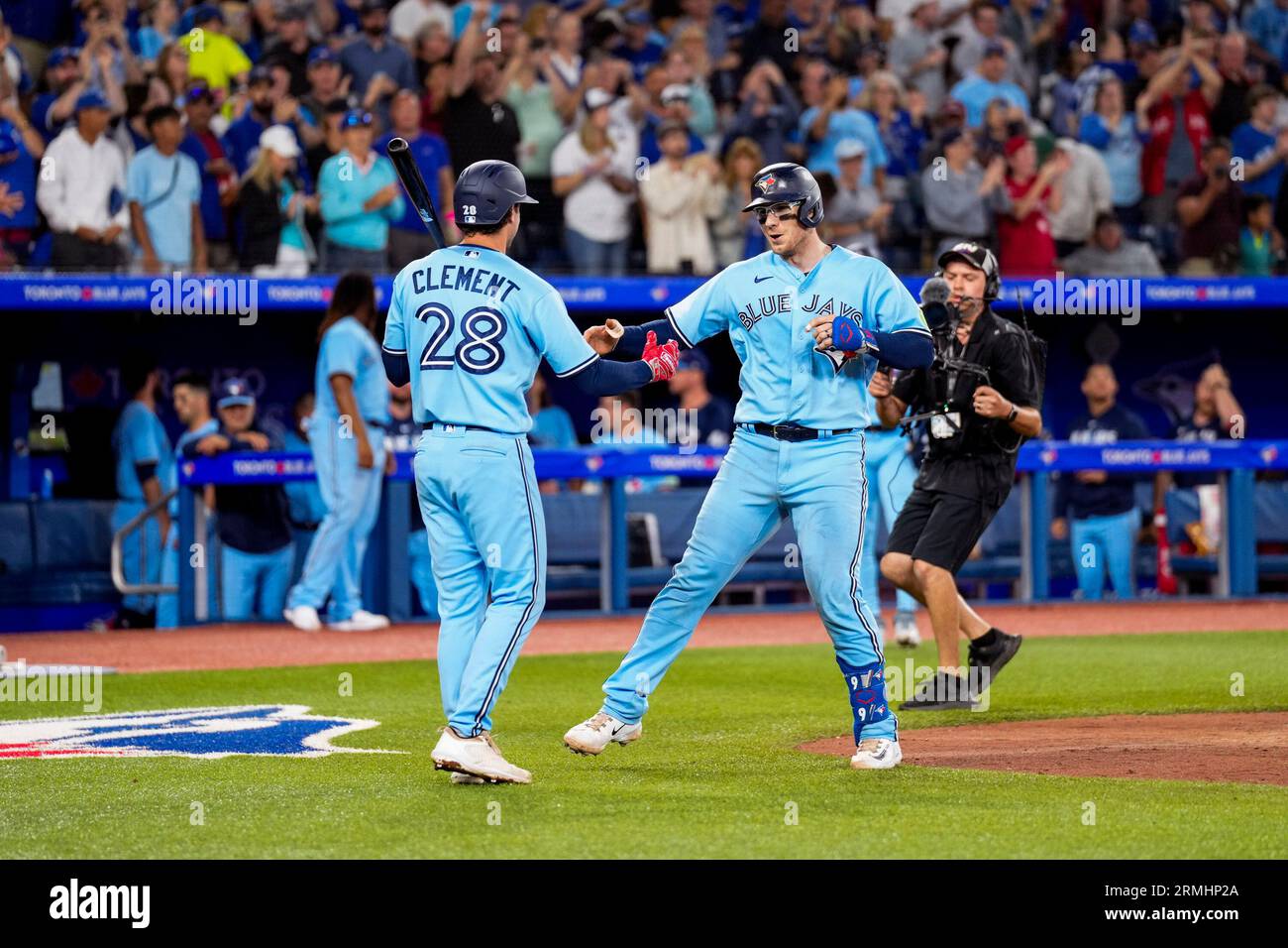Toronto Blue Jays catcher Danny Jansen (9), right, celebrates his home ...
