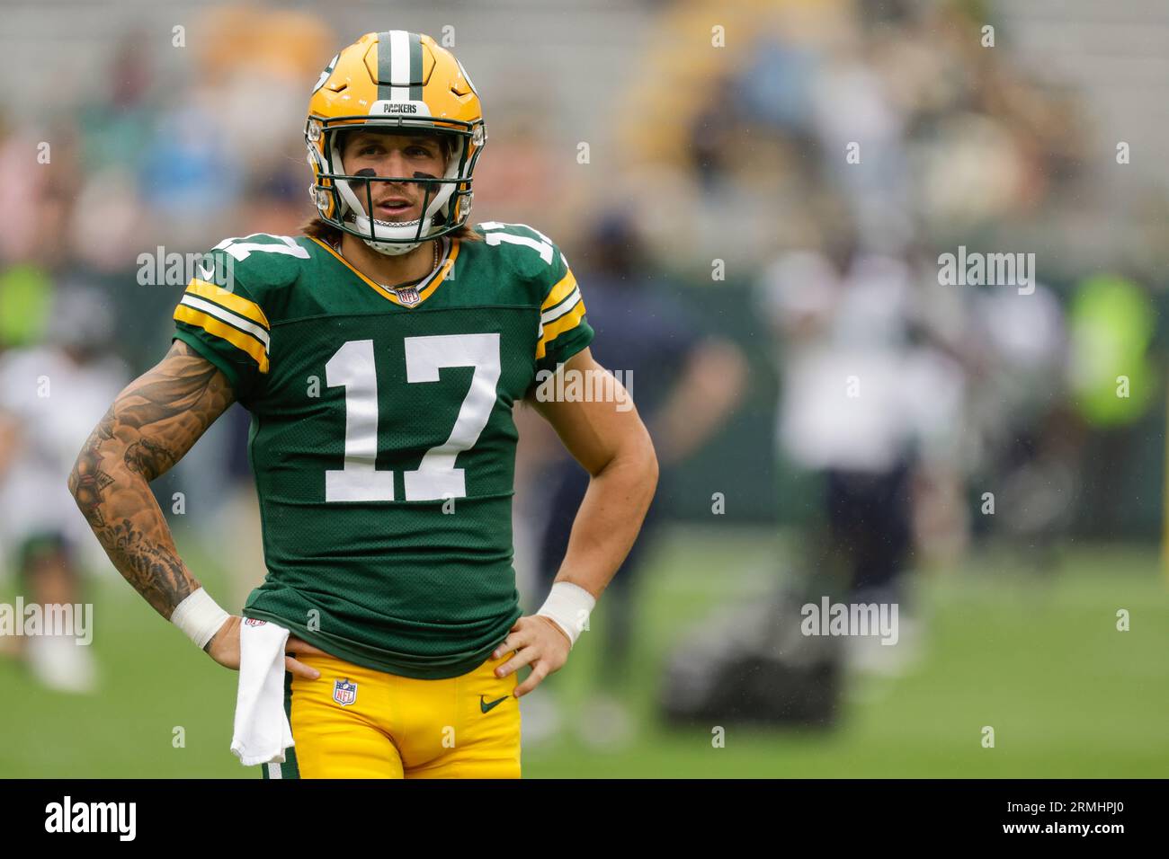 Green Bay Packers quarterback Alex McGough (17) runs onto the field ...