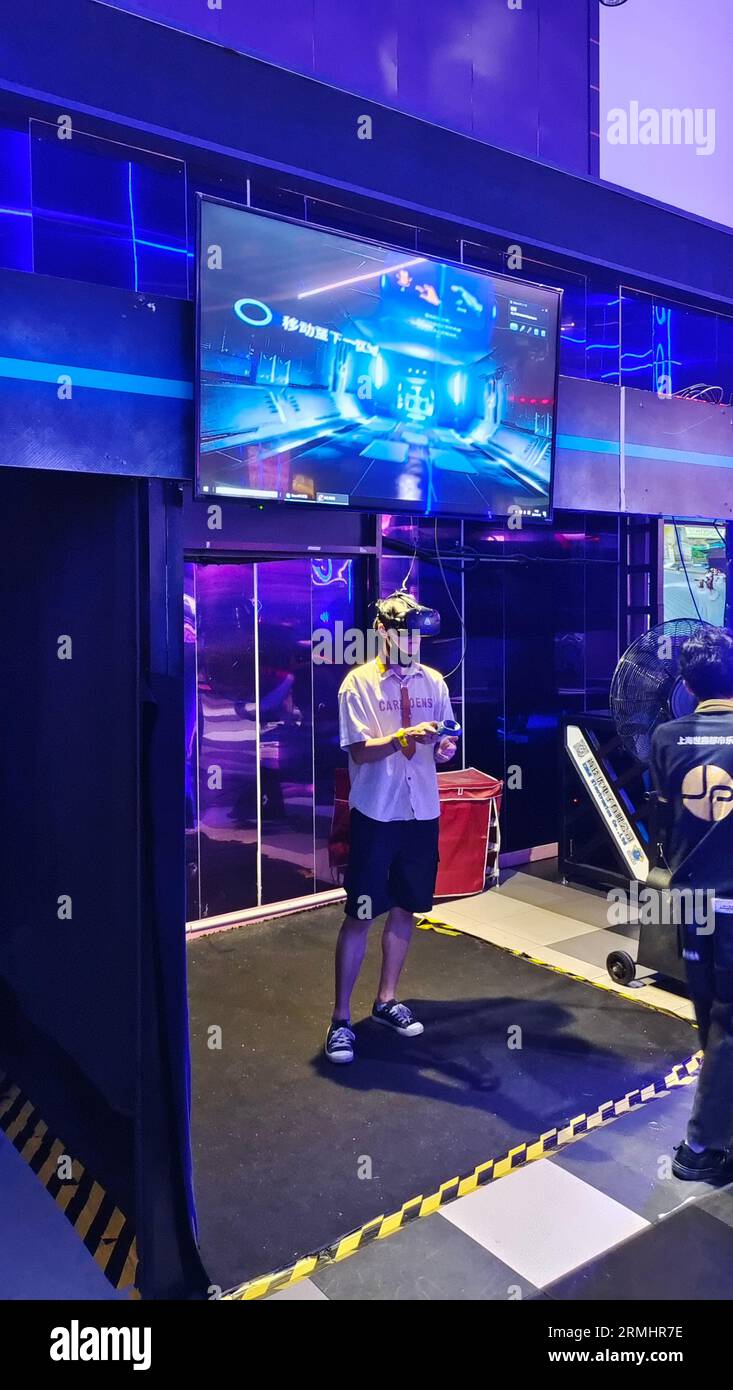 SHANGHAI, CHINA - AUGUST 28, 2023 - People play an VR game with their ...