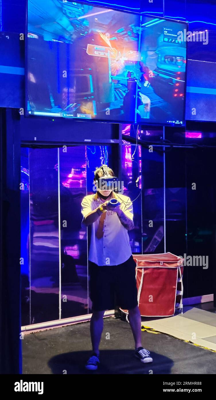 SHANGHAI, CHINA - AUGUST 28, 2023 - People play an VR game with their ...