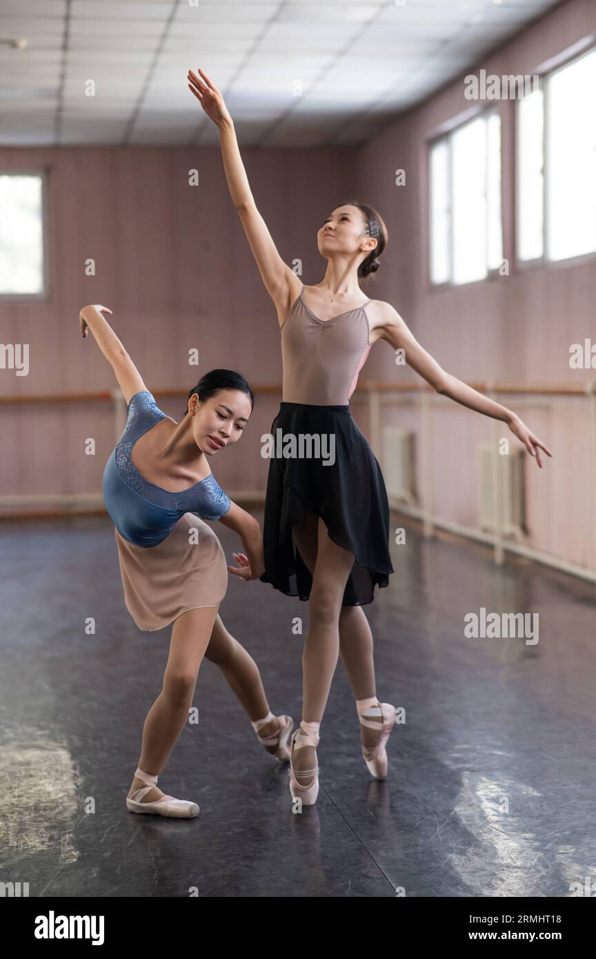 Two Asian ballerinas are dancing in the class Stock Photo - Alamy