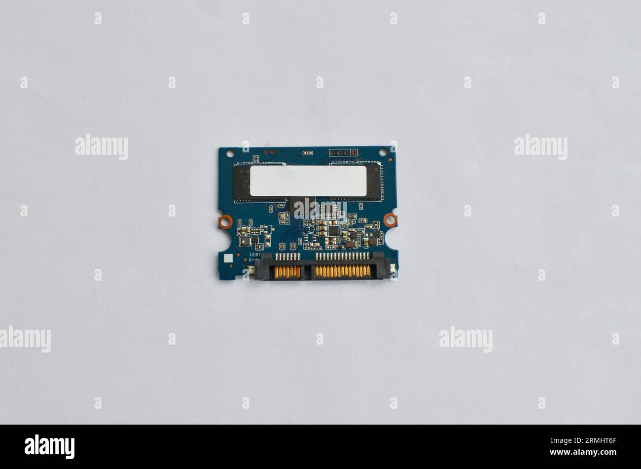 Detail of open SSD with exposed logic board for repair and data ...