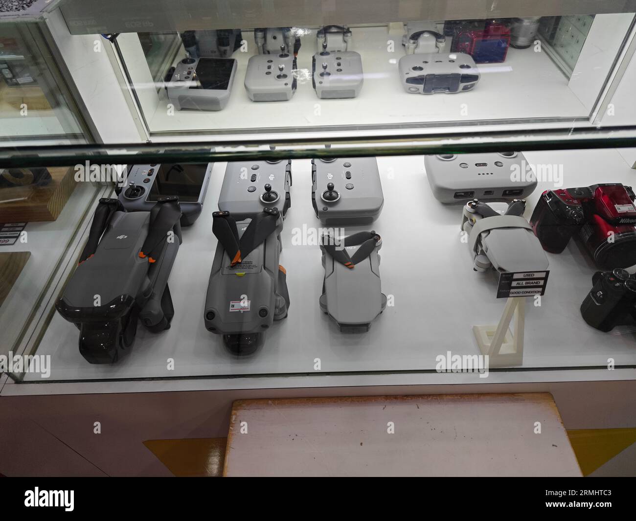 DJI drone with controller set on display and sale on one of the camera ...