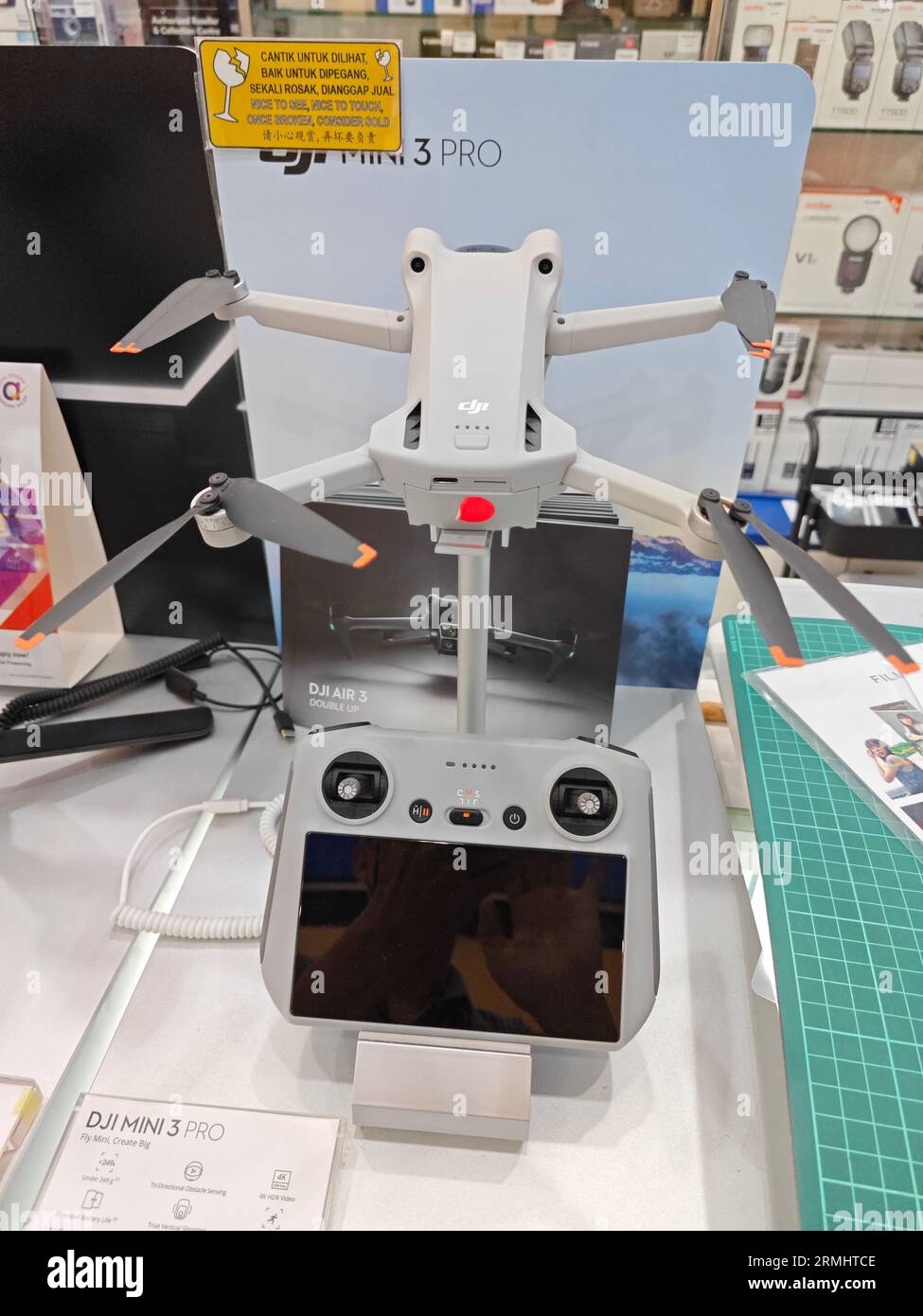 DJI drone with controller set on display and sale on one of the camera ...