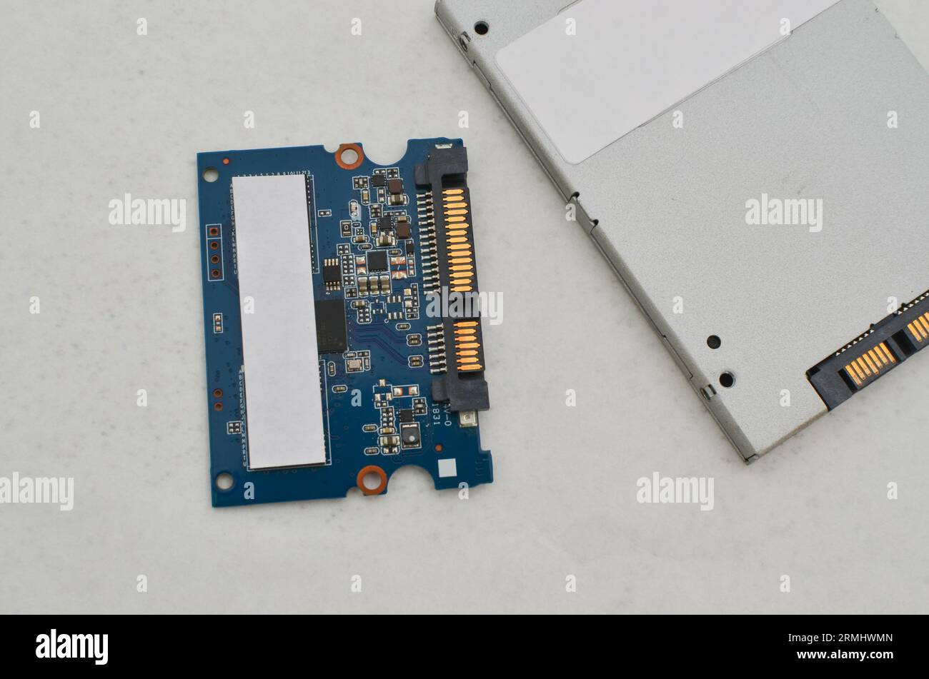 Detail of open SSD with exposed logic board for repair and data ...