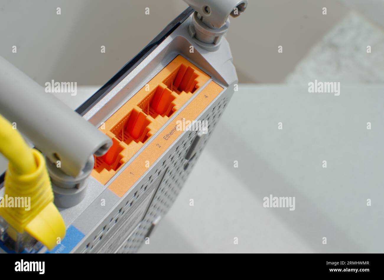 Close-up detail of a modern Wi-Fi router, with multiple inputs and ... Close-up detail of a modern Wi-Fi router, with multiple inputs and ...