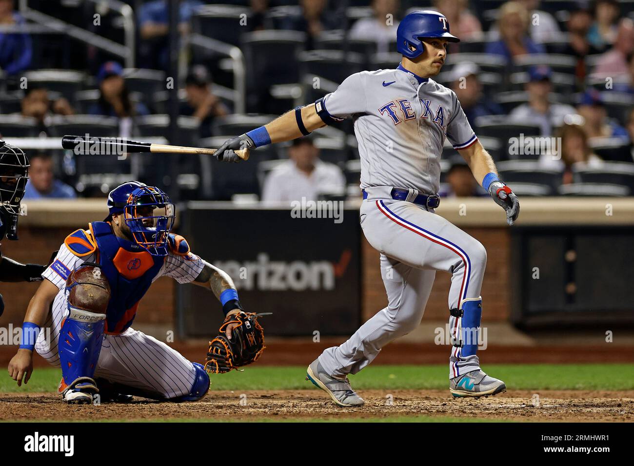 Texas Rangers' Nathaniel Lowe, right, hits a two-RBI single against the ...