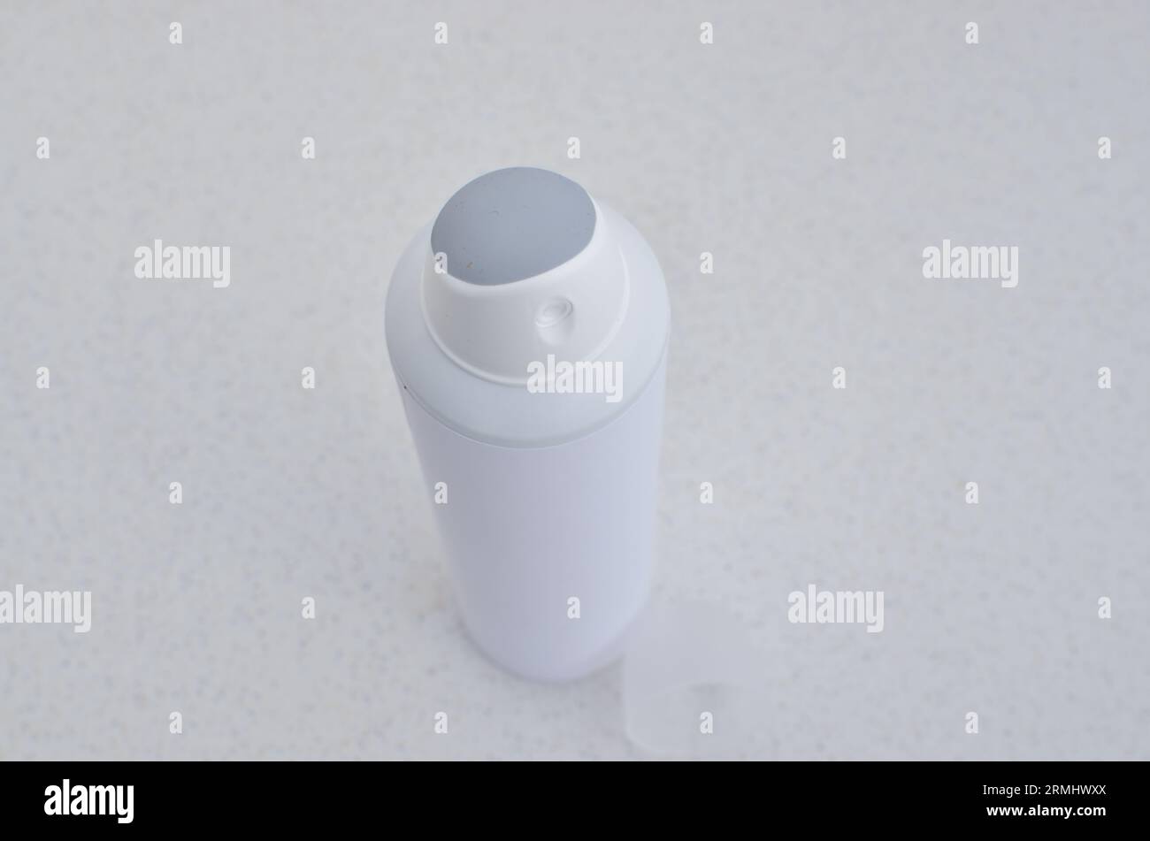 Close-up of spray deodorant with white label, conveying concepts of ...