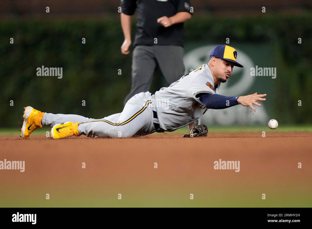 Milwaukee Brewers shortstop Willy Adames reaches for a ball hit by ...