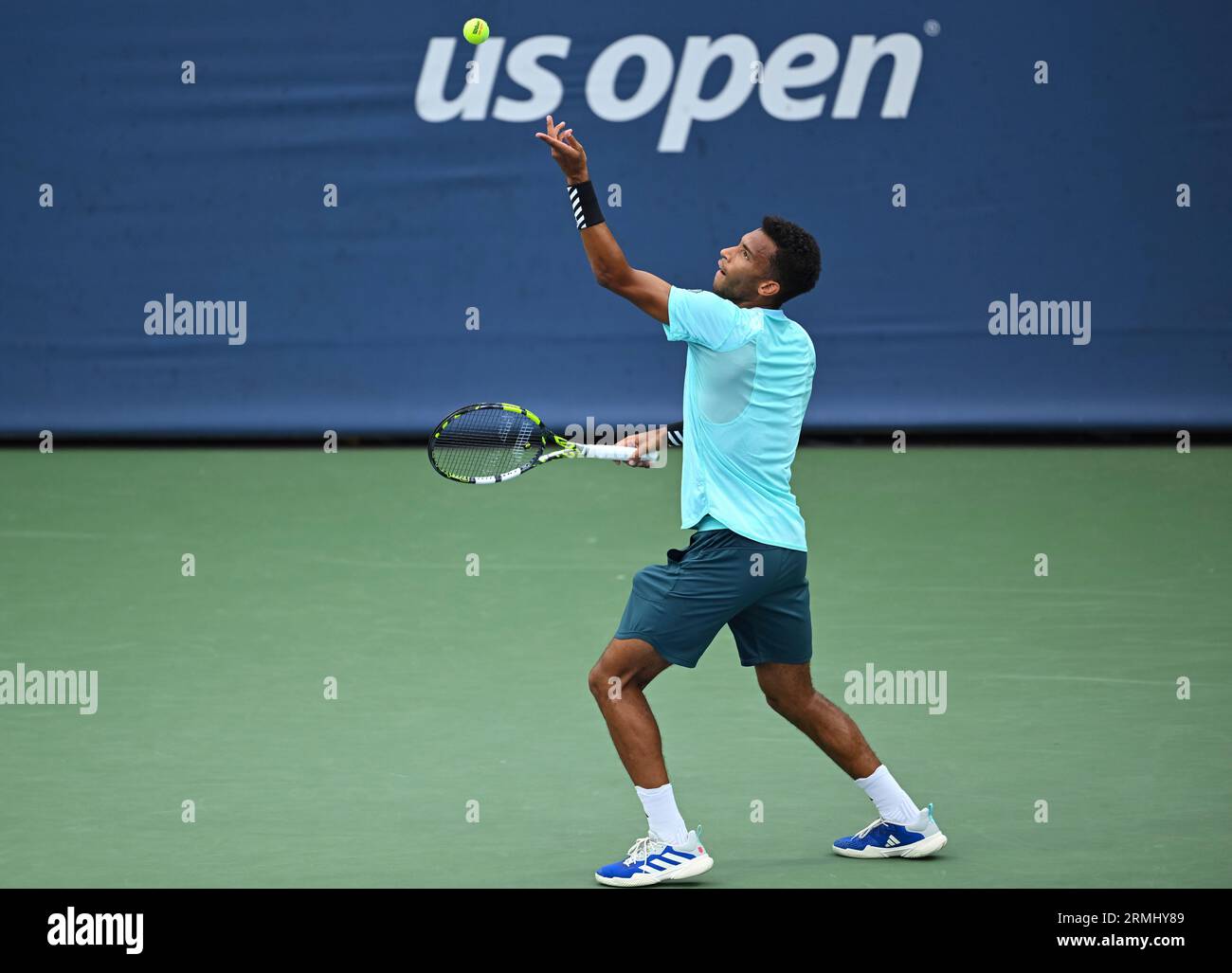 Felix Auger-Aliassime serves during a men's singles match at the 2023 ...