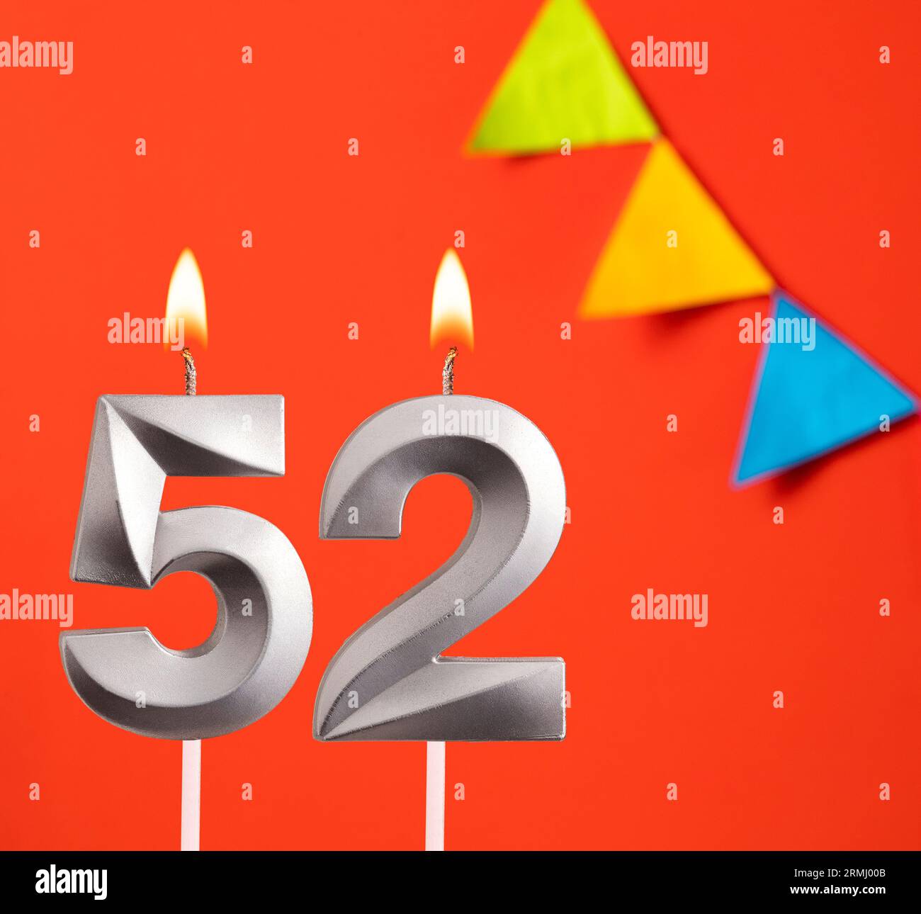 Birthday card - Number 52 candle in orange background Stock Photo - Alamy