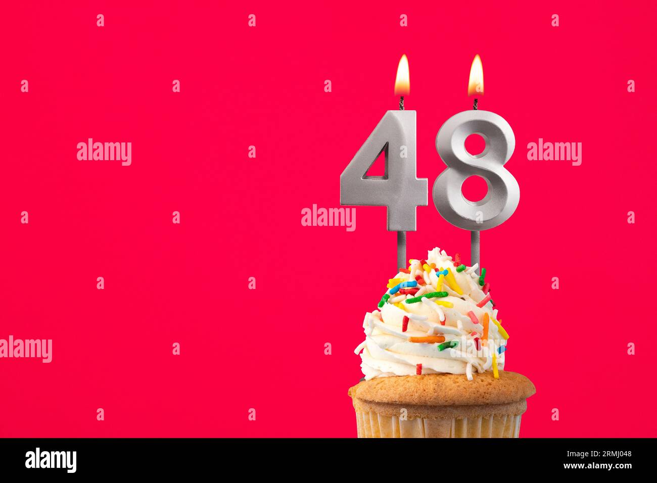 Burning candle number 48 - Birthday card with cake Stock Photo - Alamy