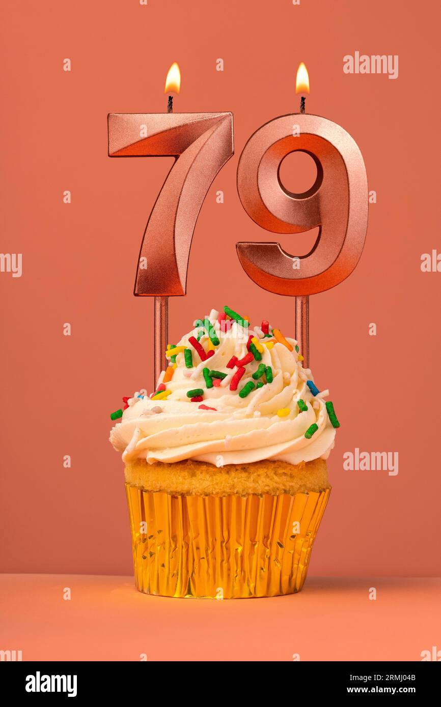 Birthday cake with candle number 79 - Coral fusion background Stock ...