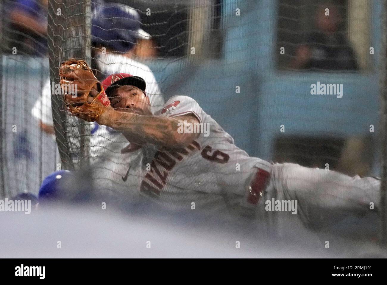 Arizona Diamondbacks third baseman Jace Peterson crashes into the ...
