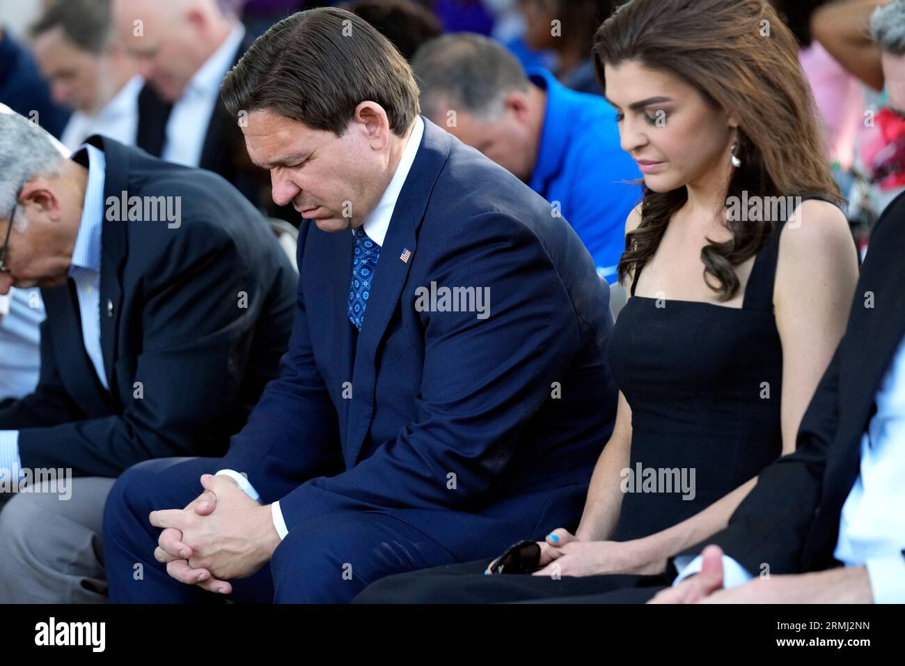 FILE - Florida Gov. Ron DeSantis, center and his wife Casey, right, bow ...