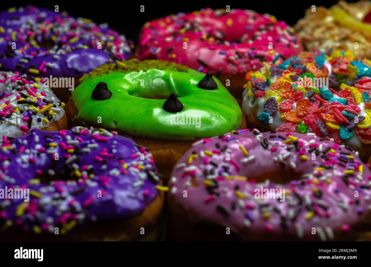 Cluster of colorful doughnuts Stock Photo - Alamy