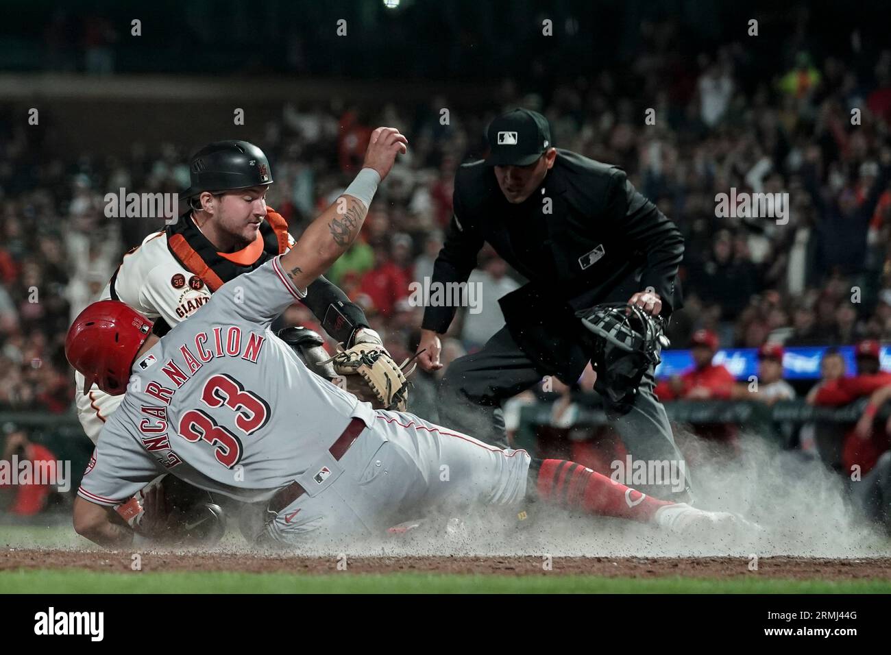 Cincinnati Reds' Christian Encarnacion-Strand (33) is tagged out at ...