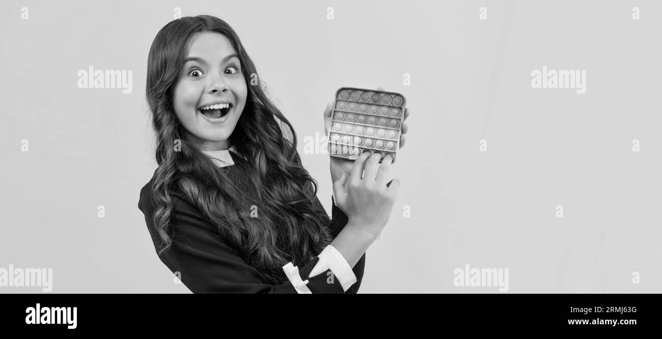 press button antistress silicone toy. sensory fidgeting. girl with ...