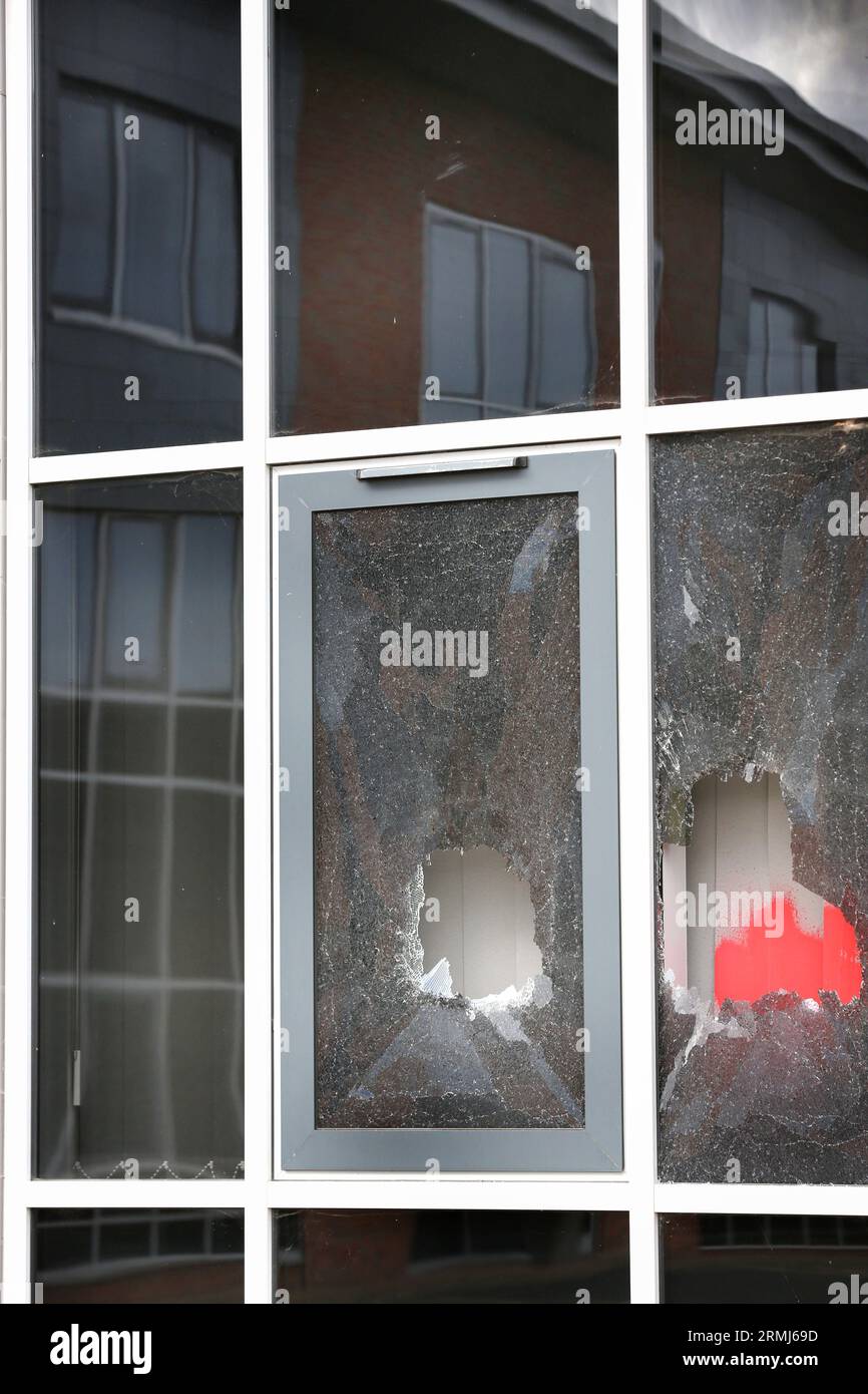 A window is smashed and red paint is sprayed inside the office at the ...