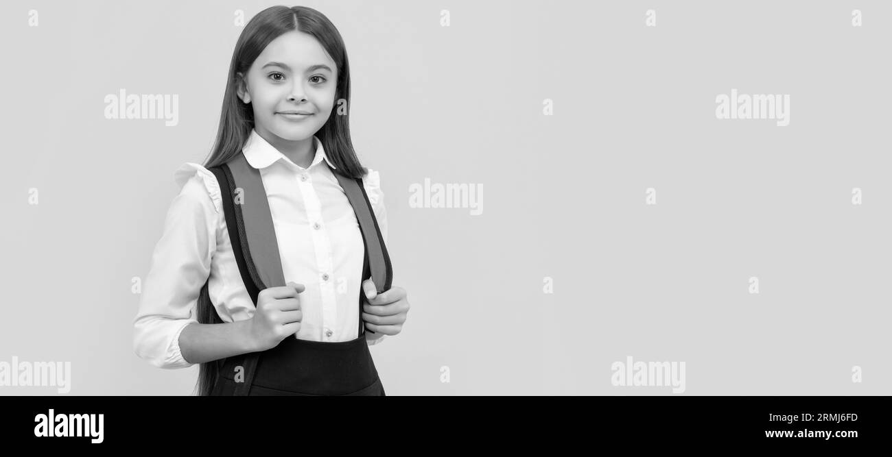 smiling child in school uniform carry school bag, education. Horizontal ...