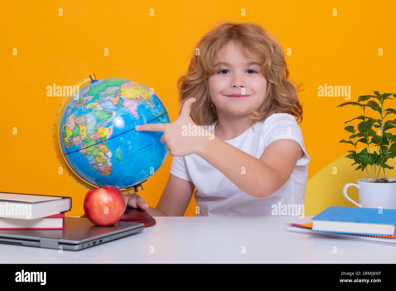 Little student school child isolated on studio background. Portrait of ...