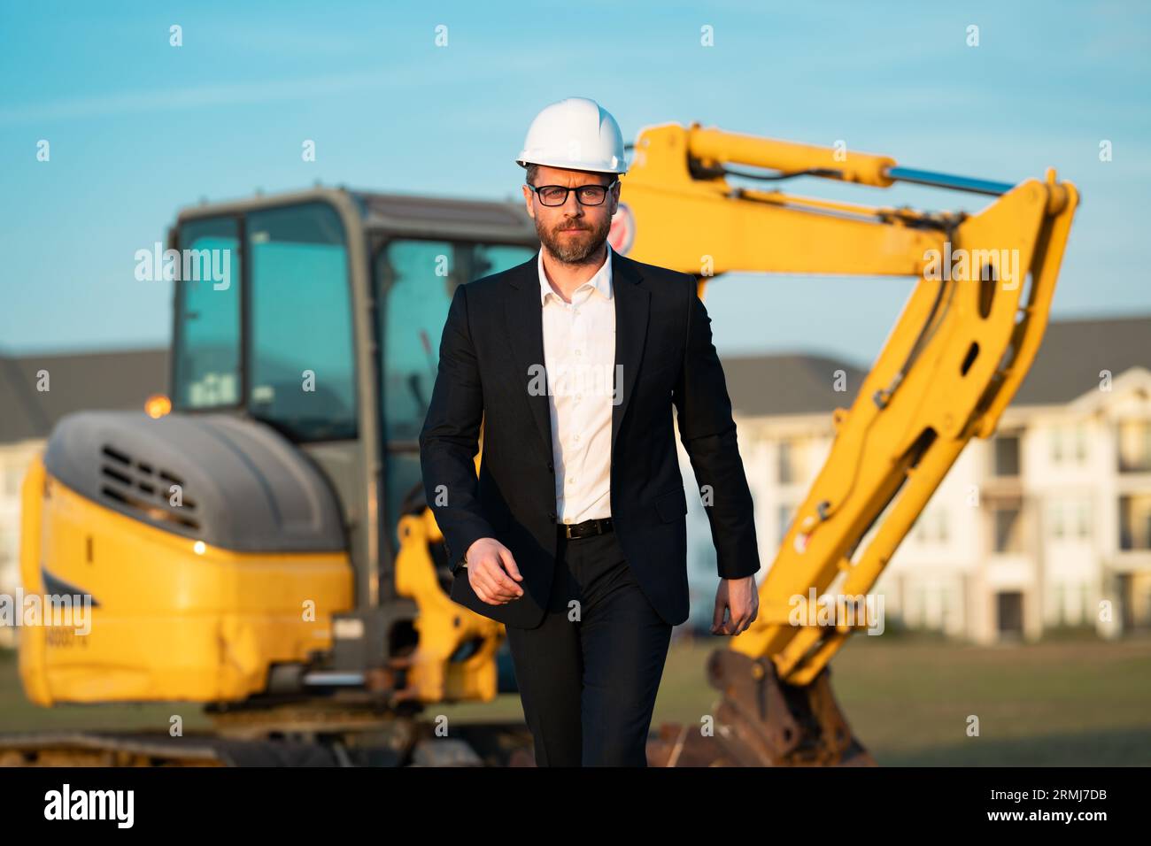 Civil engineer worker at a construction site. Engineer man in front of ...