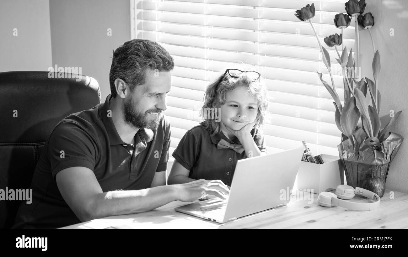 happy daddy or teacher helping his school son kid in glasses study with ...