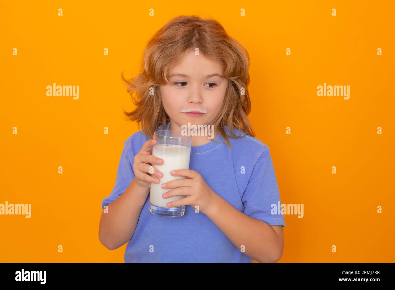 Kid drink fresh milk. Studio isolated portrait of child drinking milk ...