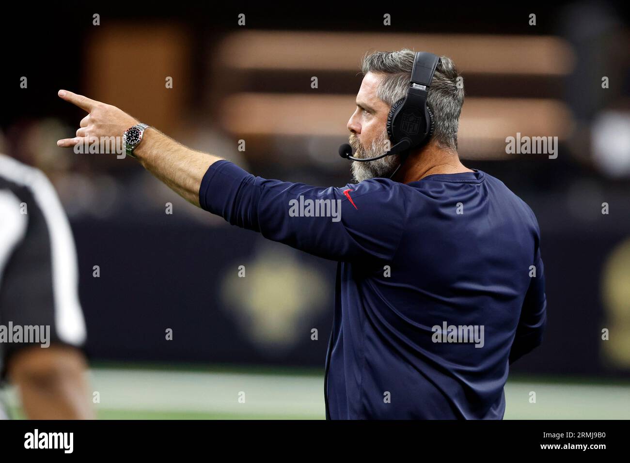 Houston Texans defensive coordinator Matt Burke signals to players ...