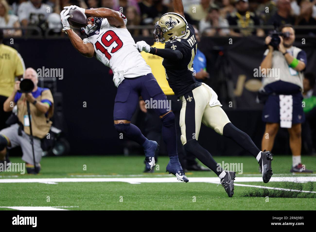 Houston Texans wide receiver Xavier Hutchinson (19) catches a pass over ...