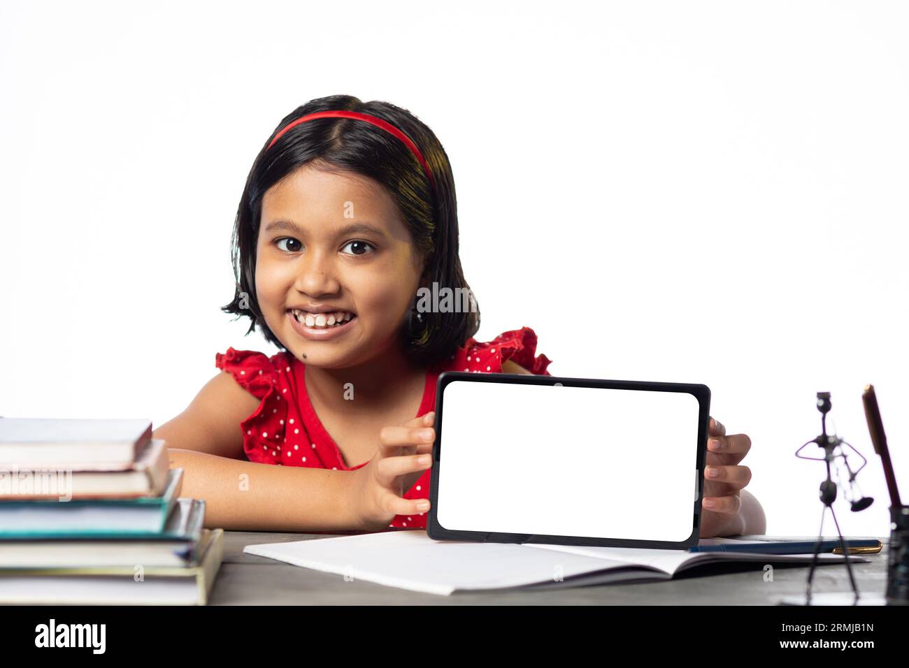 Indian kid showing tablet isolated hi-res stock photography and images ...