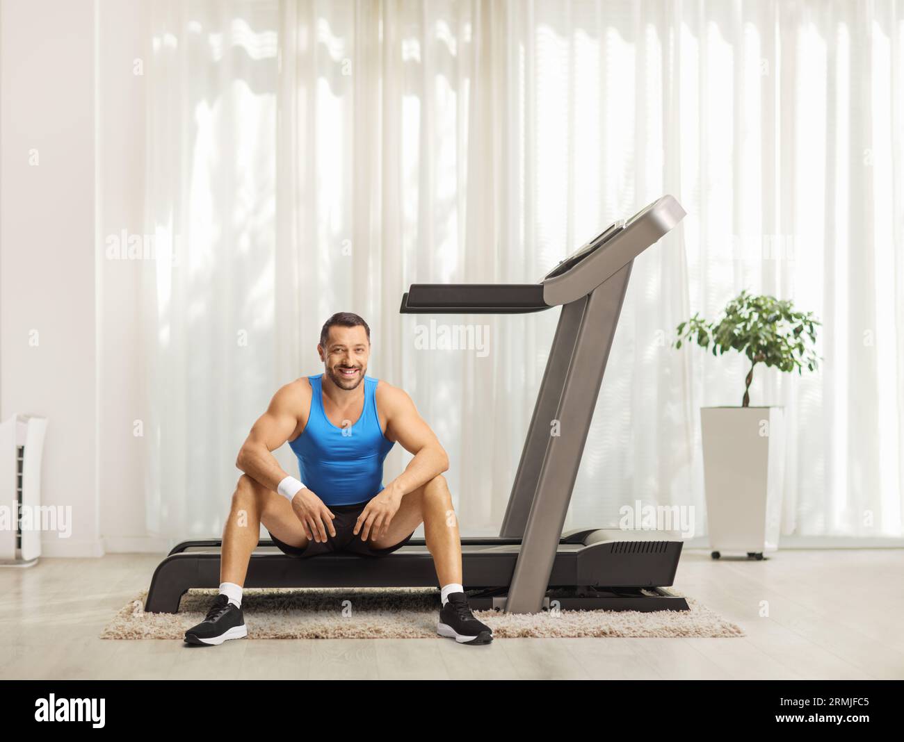 Male exercising on treadmill home hi-res stock photography and images ...