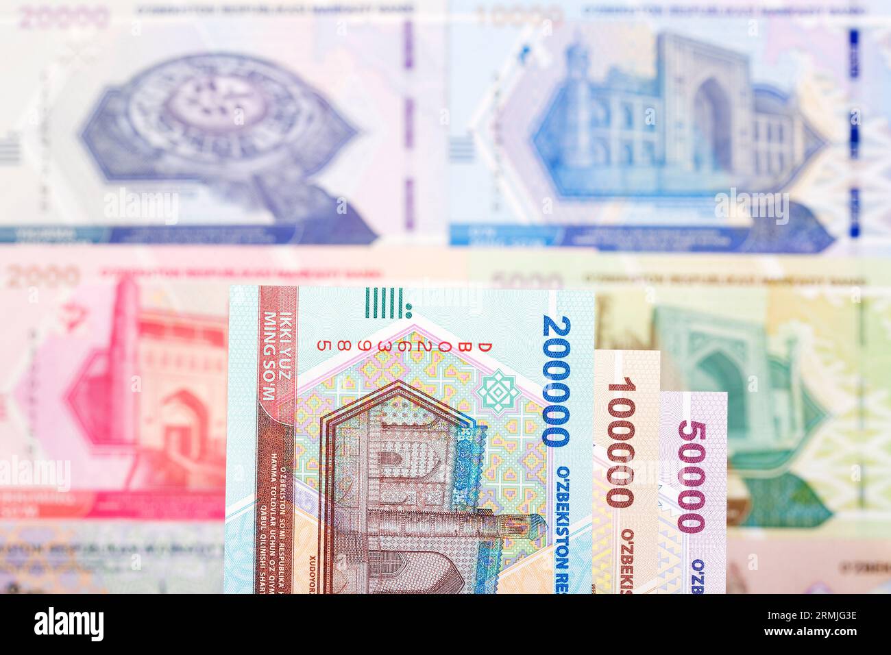 Uzbekistani money - sum a business background Stock Photo - Alamy