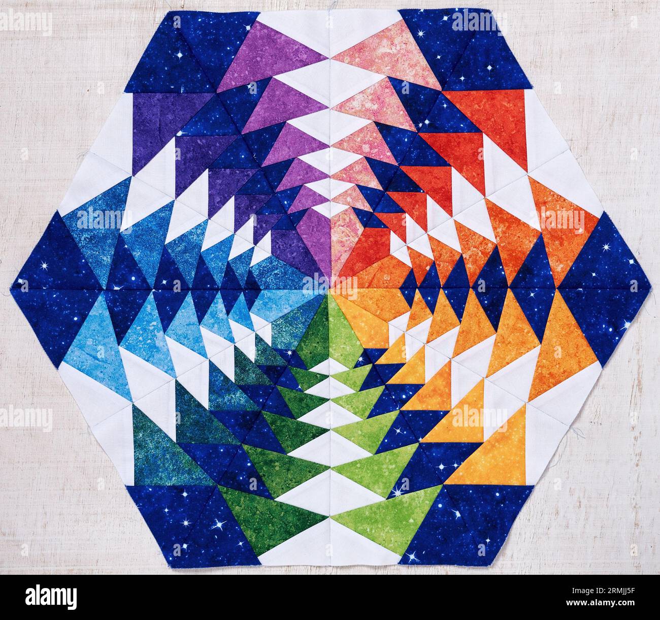 Hexagon patchwork block like a kaleidoscope from pieces of fabrics ...