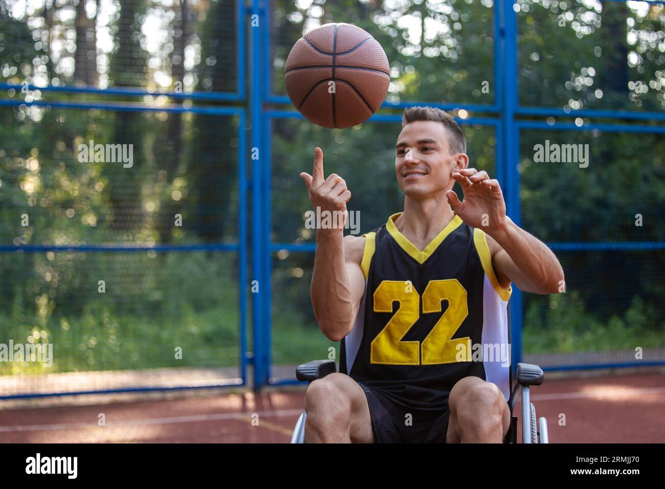 Wheelchair basketball player holding, disability, outdoor basketball ...