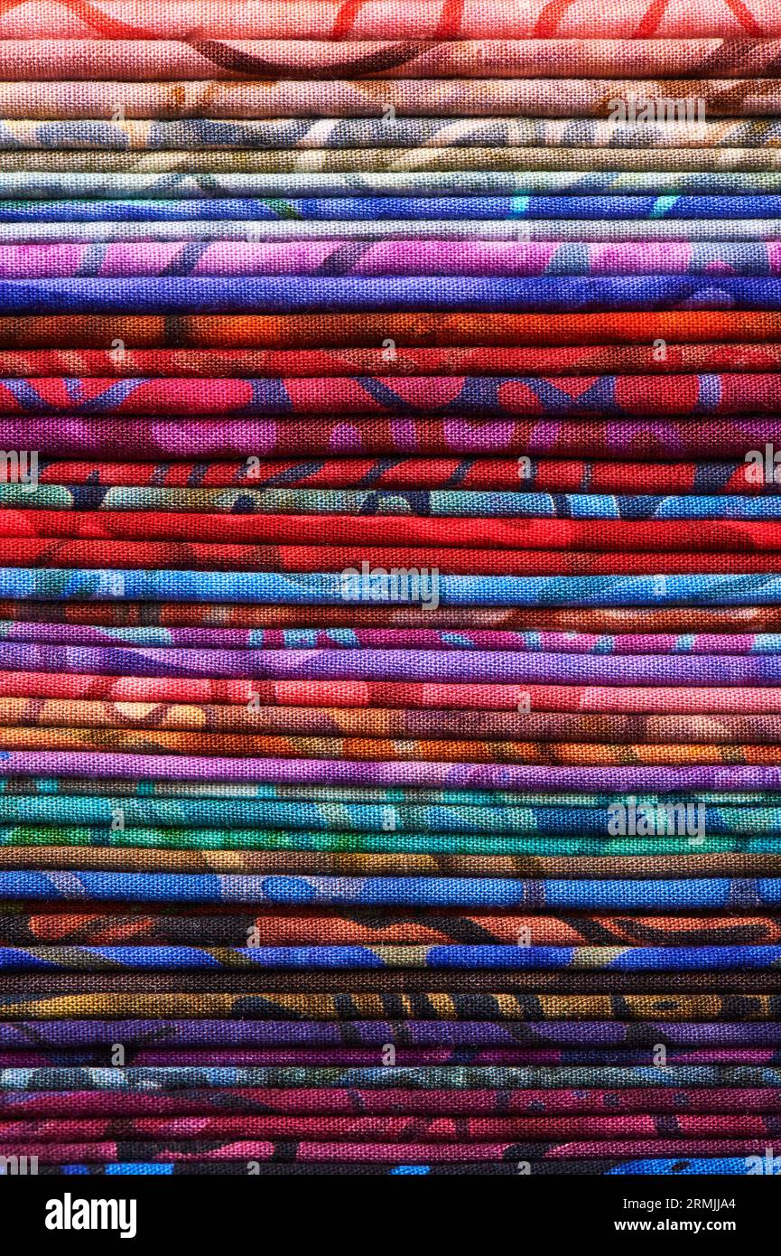 Stack of colorful batik fabrics as a vibrant background image Stock ...