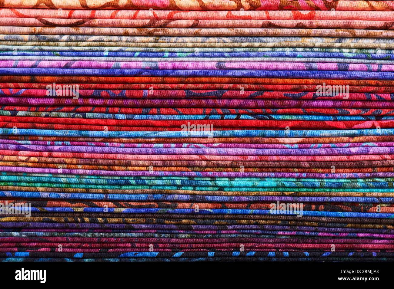 Stack of colorful batik fabrics as a vibrant background image Stock ...