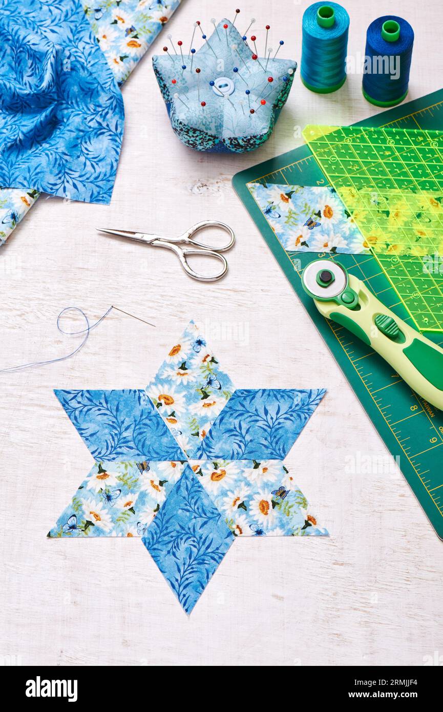 Prepare of diamond pieces of fabric for sewing quilt, top view Stock ...