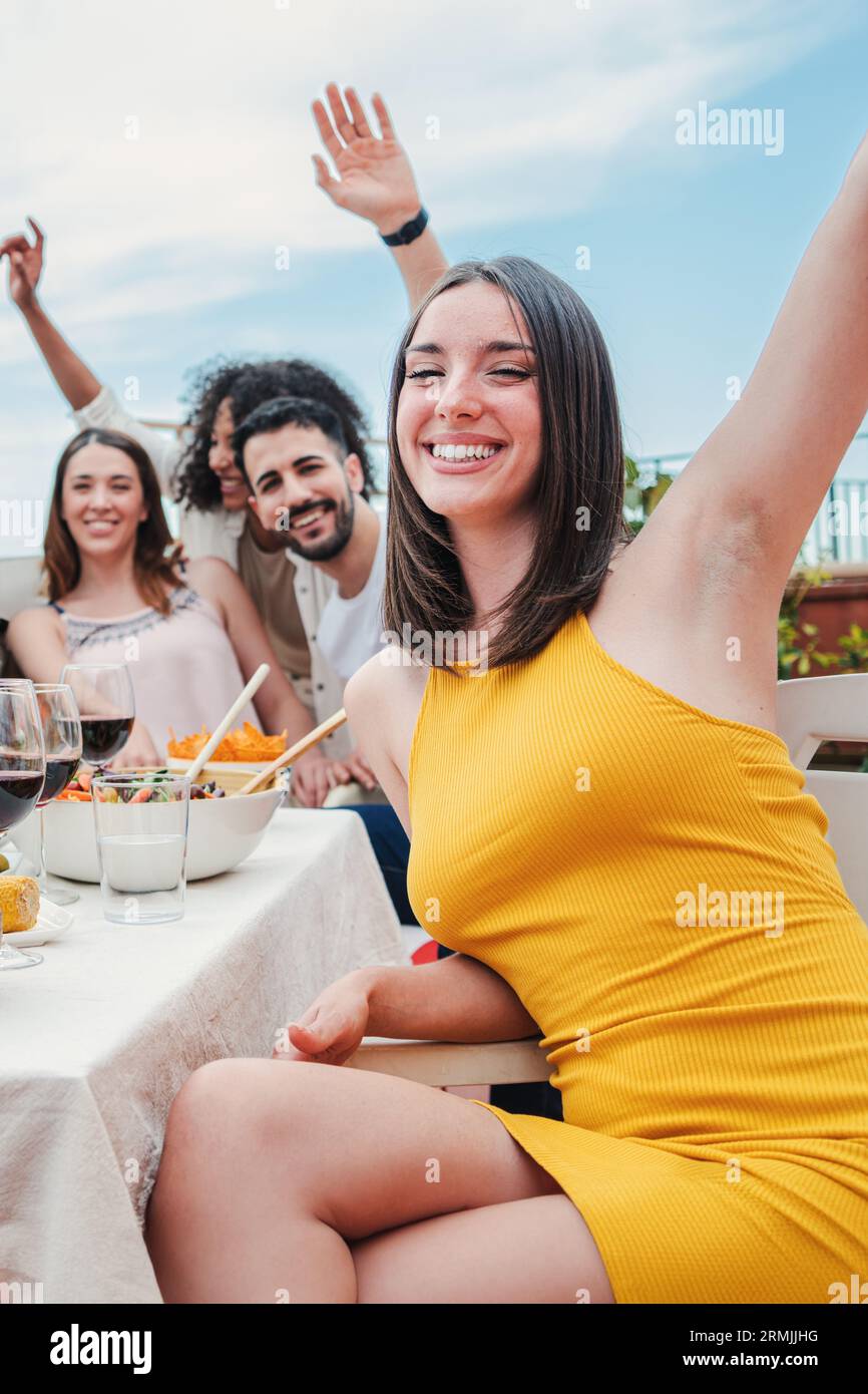 Group of young adult friends having fun and laughing on a dinner party ...