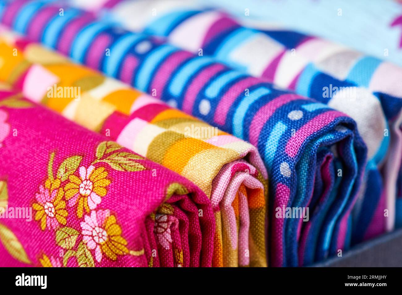 Folded pieces of quilting fabrics lying in a box, macro Stock Photo - Alamy