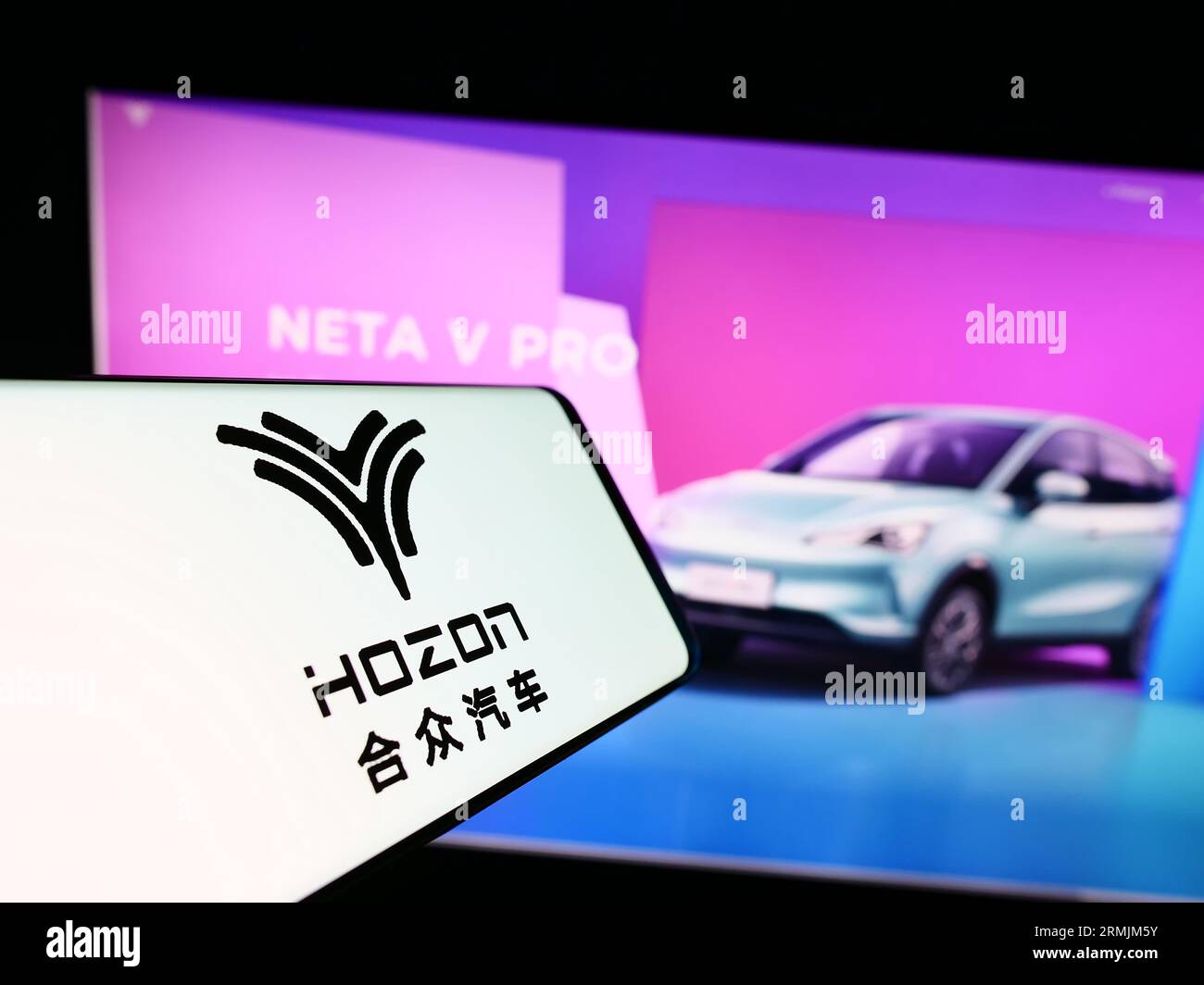 Mobile phone with logo of Hozon Auto New Energy Automobile Co. Ltd. on ...