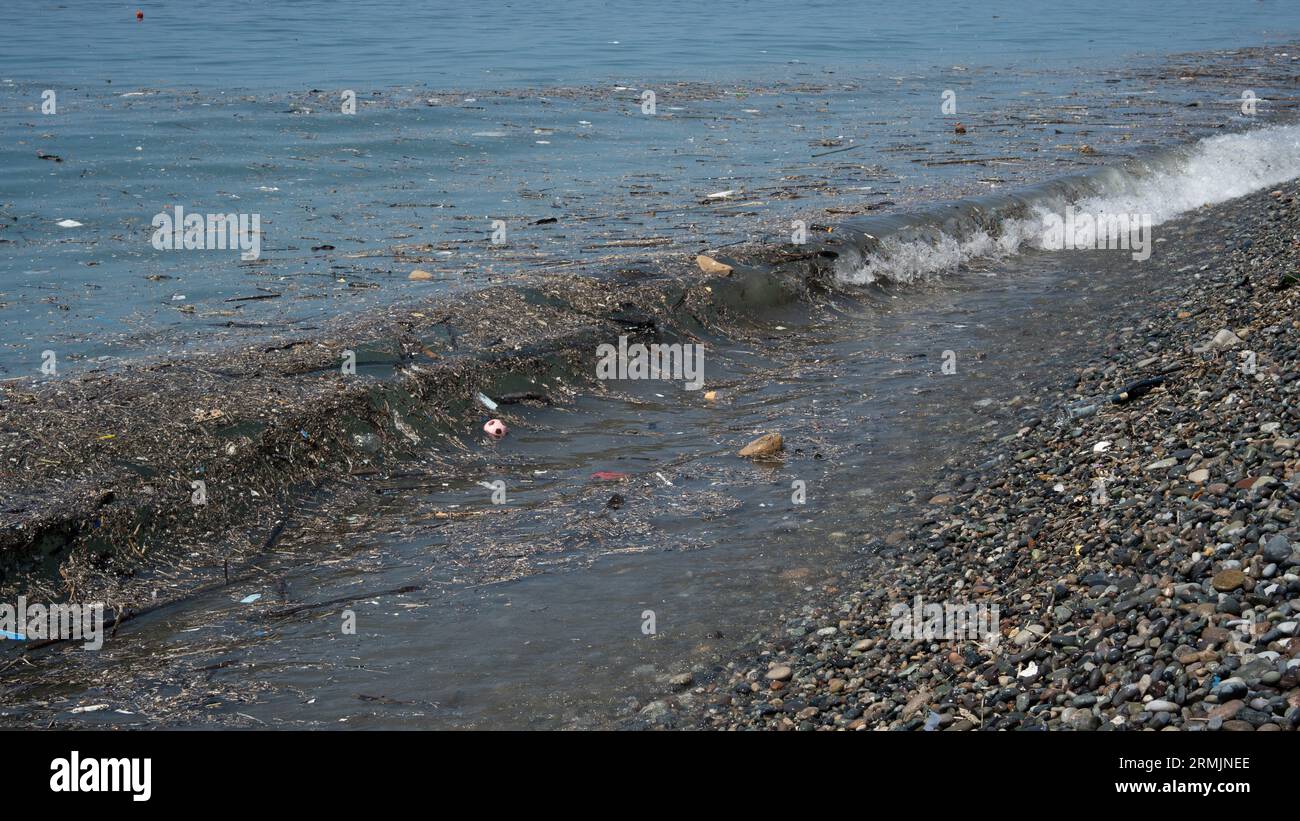 The sea surf is littered with garbage. The problem of pollution of the ...