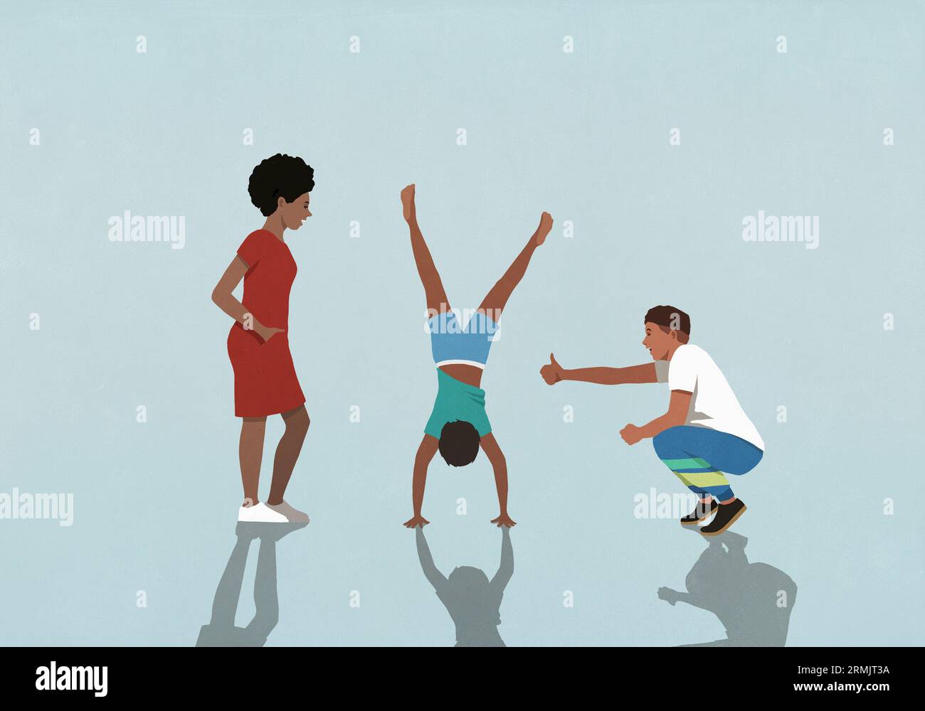 Supportive parents cheering for son doing handstand Stock Photo - Alamy