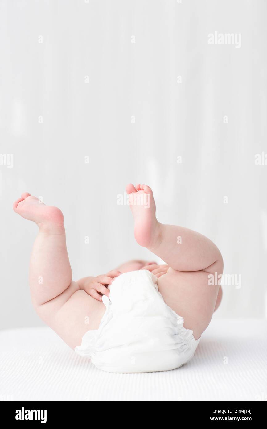 Close up of baby's feet lying on back Stock Photo - Alamy