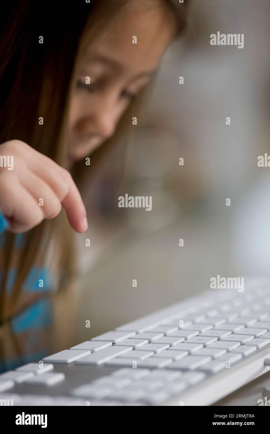 Close up of little girl hand typing on computer keyboard Stock Photo ...