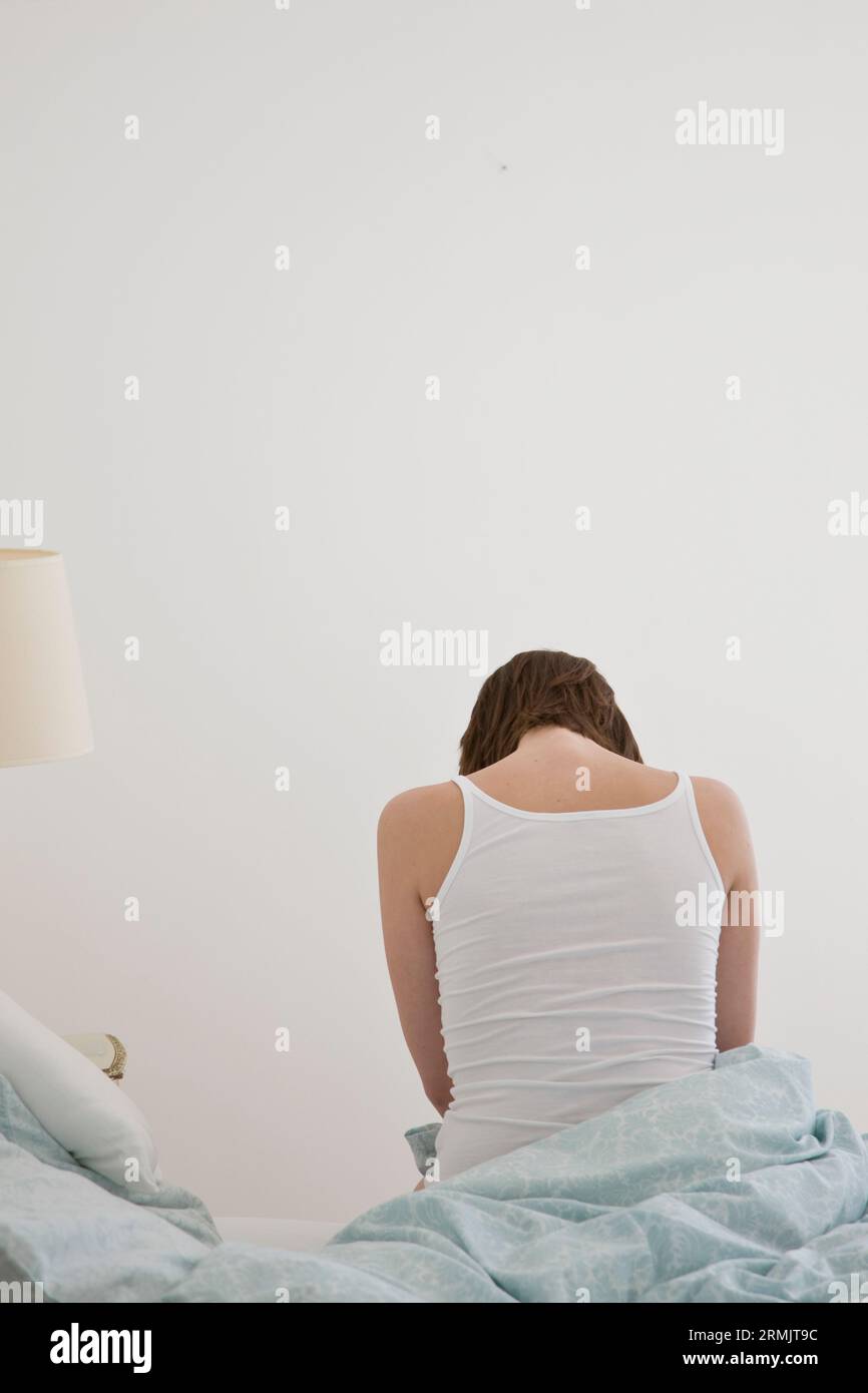 Female bed back view sitting hi-res stock photography and images - Alamy