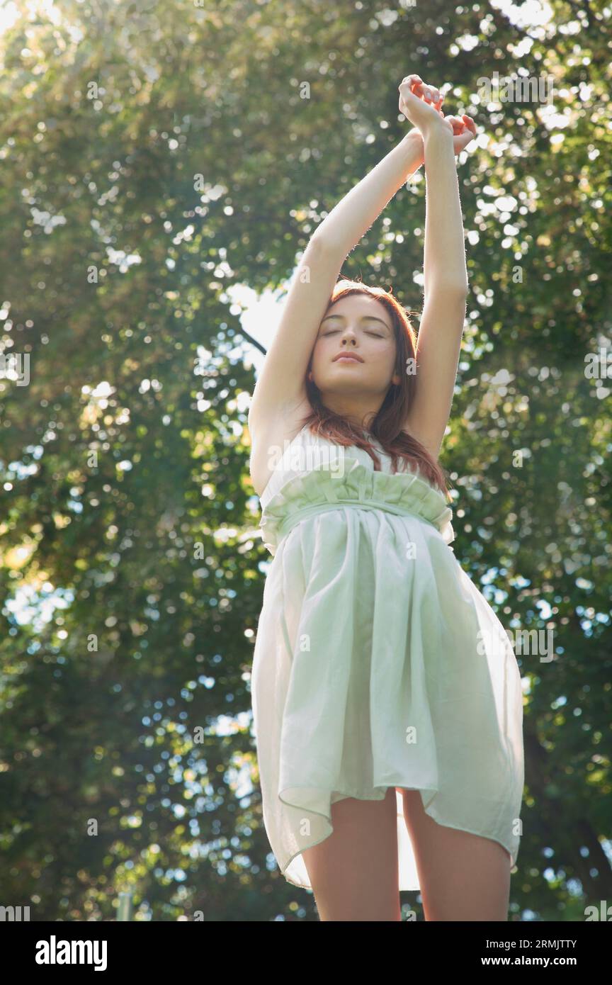 Young woman dancing outdoors hi-res stock photography and images - Alamy