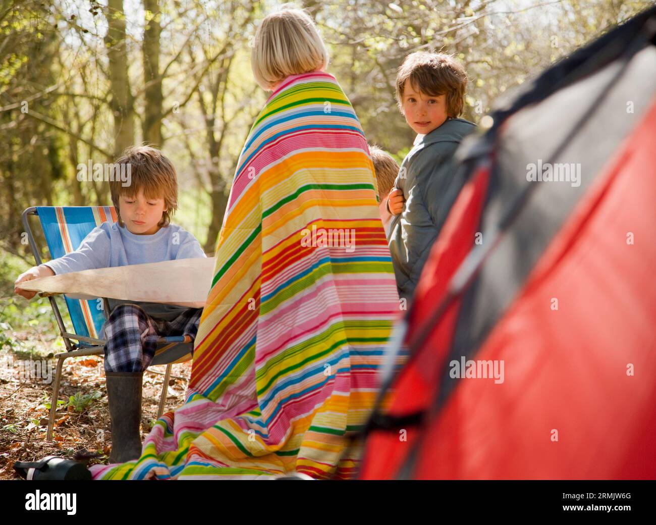 Children at campsite looking at map Stock Photo - Alamy