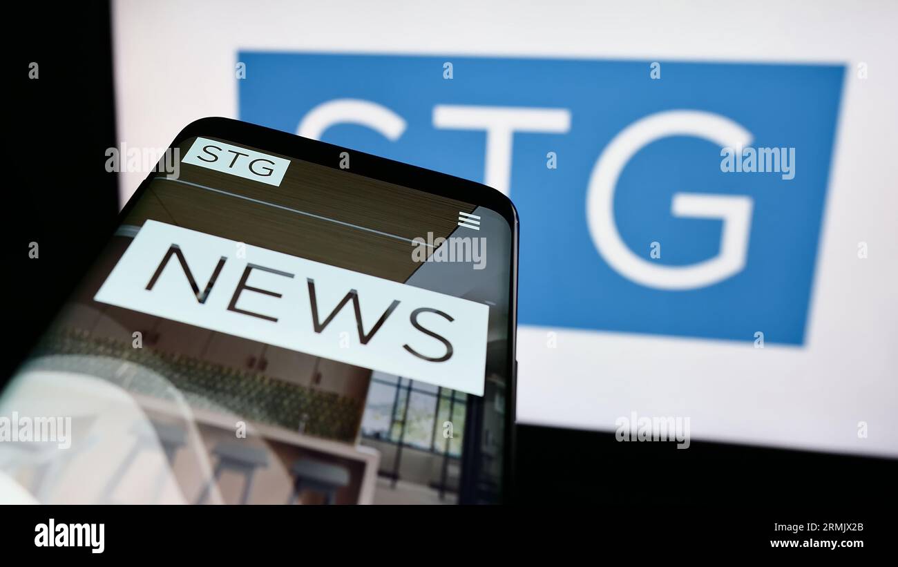 Smartphone with webpage of US private equity company STG Partners LLC ...